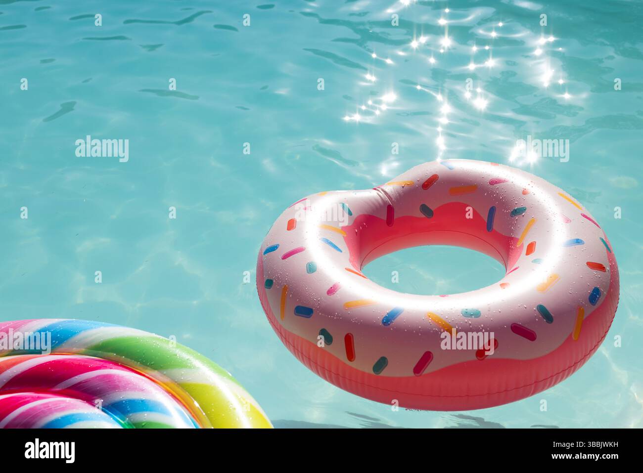 Donut shaped pool toy hi-res stock photography and images - Alamy