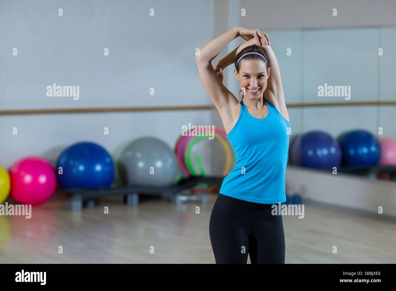 Woman raising arms overhead hi-res stock photography and images - Alamy