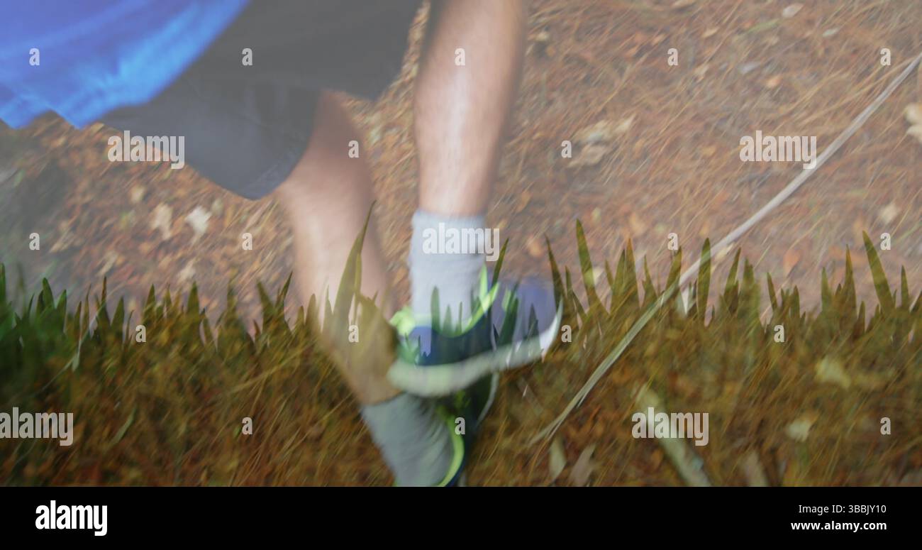 Image of grass over legs of caucasian man running Stock Photo - Alamy