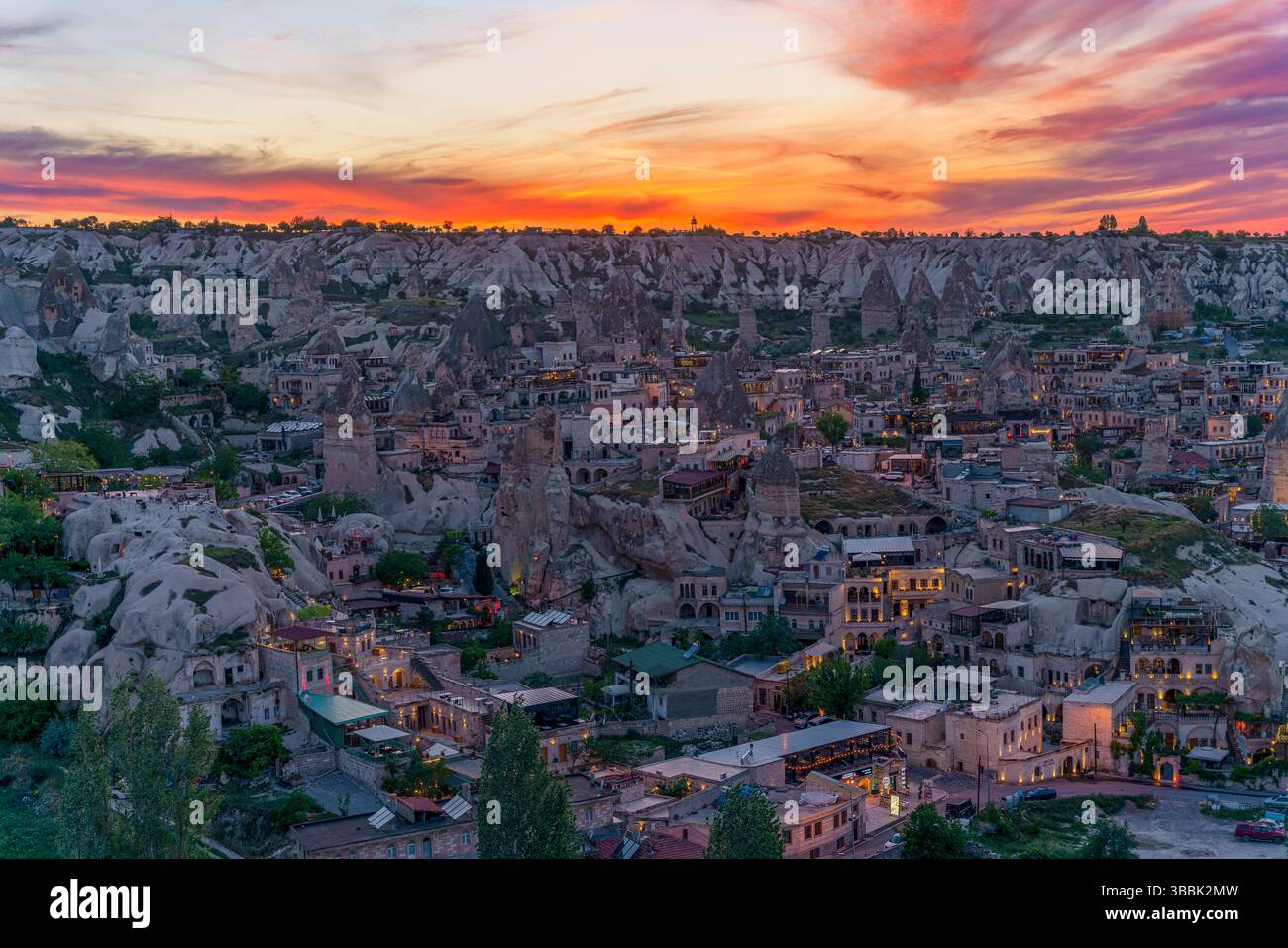 Fairy chimneys and stone houses cover the slopes in Cappadocia Goreme ...