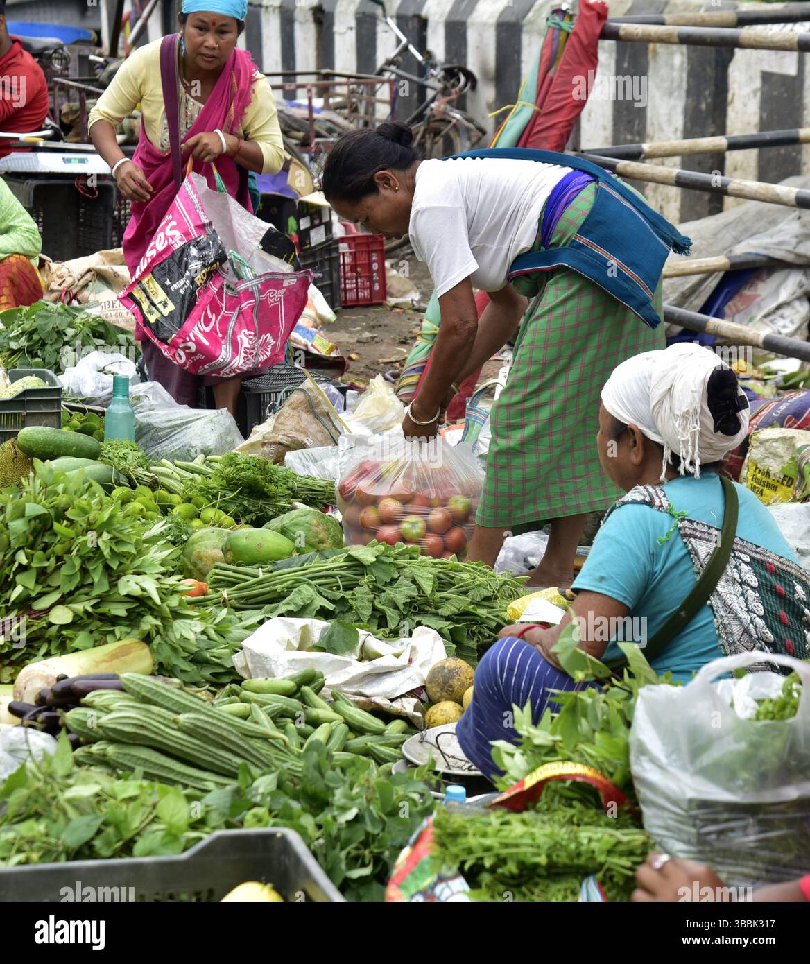 Guwahati, Guwahati, India. 16th May, 2025. Tribal women sell vegetables ...