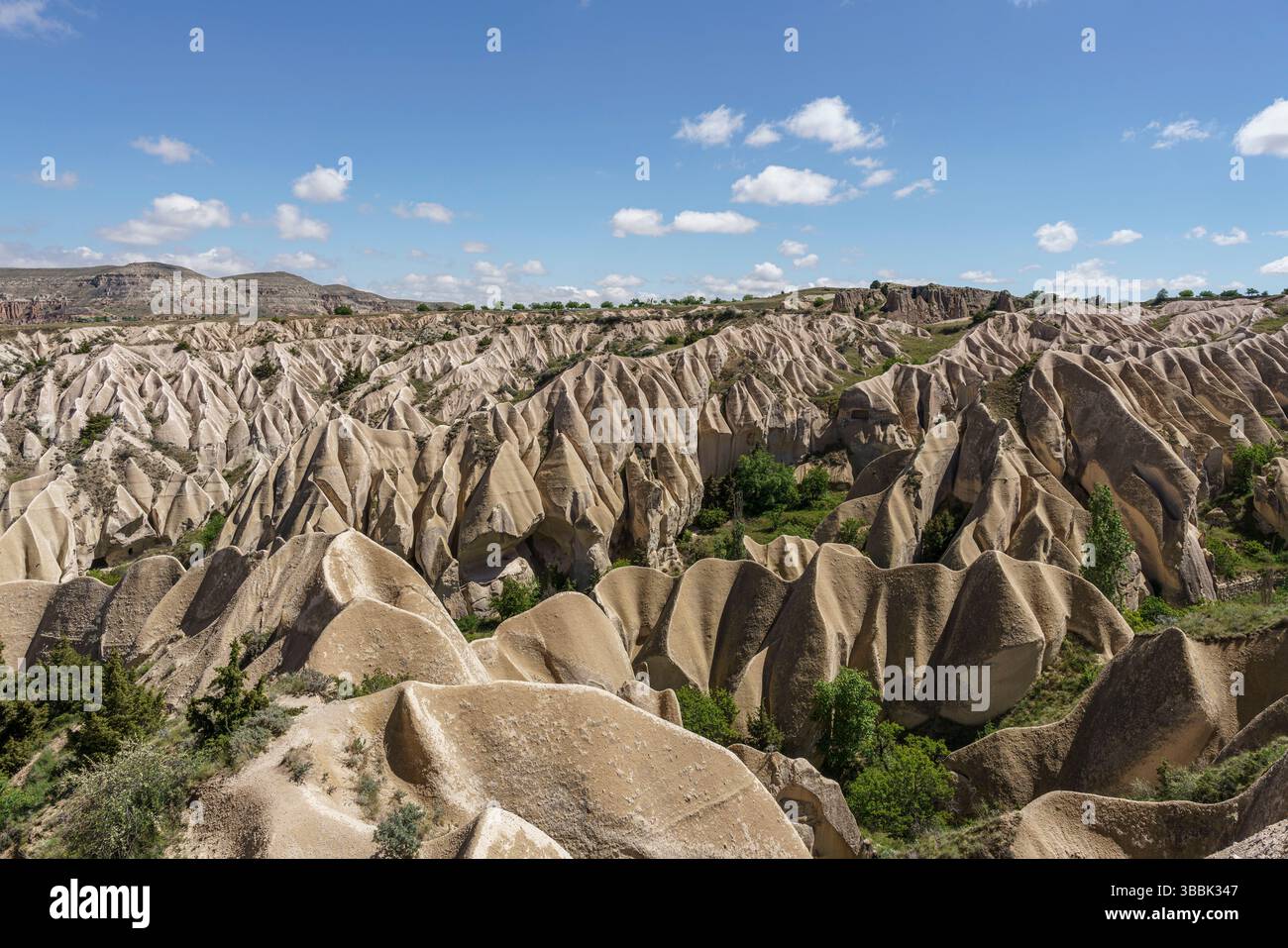 Distinctive rock spires and valleys shape the dramatic terrain of ...