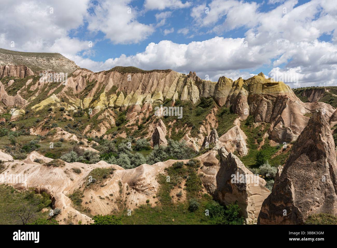 Curved rock walls and layered ridges shape the rugged scenery in ...