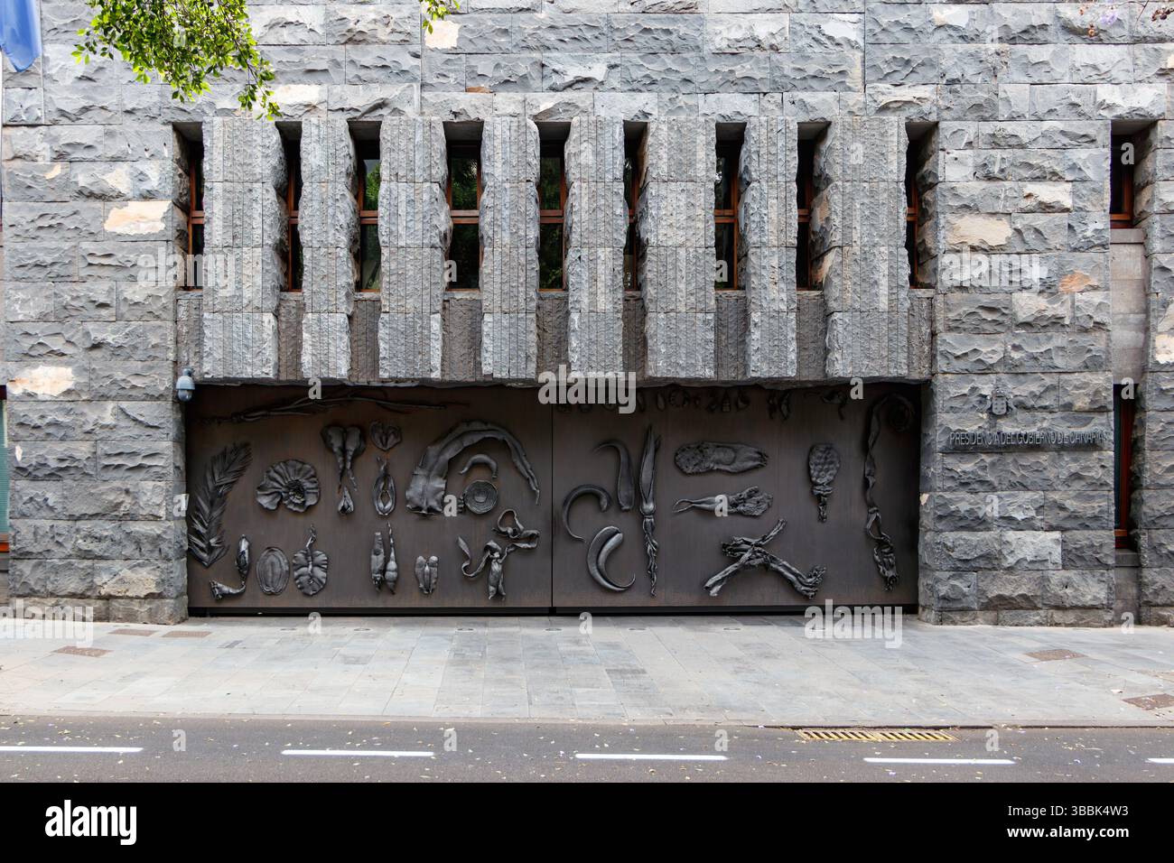 Stone facade of a building with unique vertical pillars and artistic ...