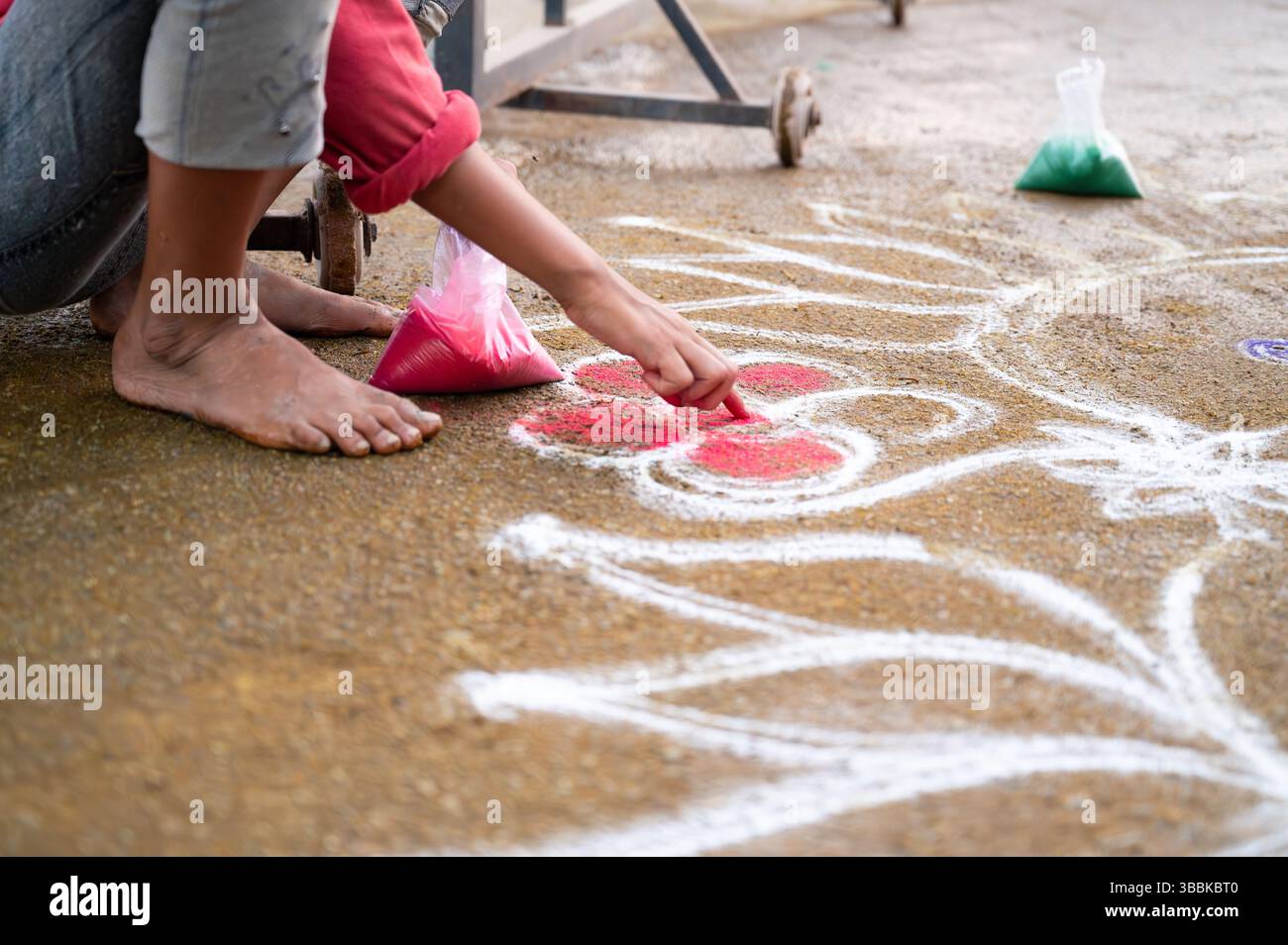 Kolam, colorful sandpainting with rice powder drawn by women and girls ...