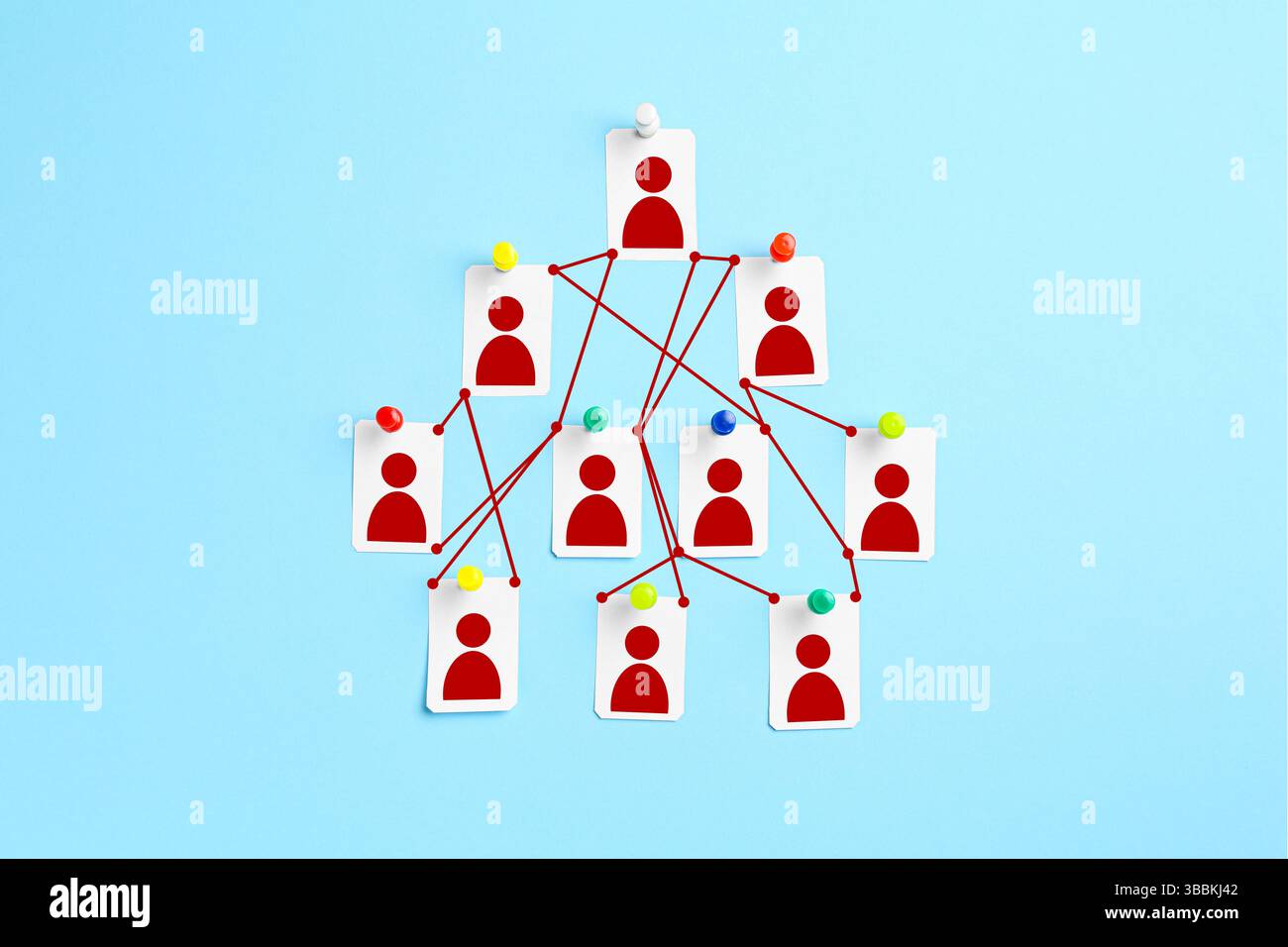 Cards with human icons pinned to light blue background and connected to ...