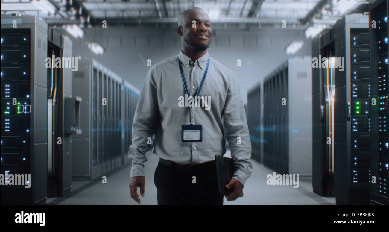 African American Administrator with Digital Tablet Walking in ...