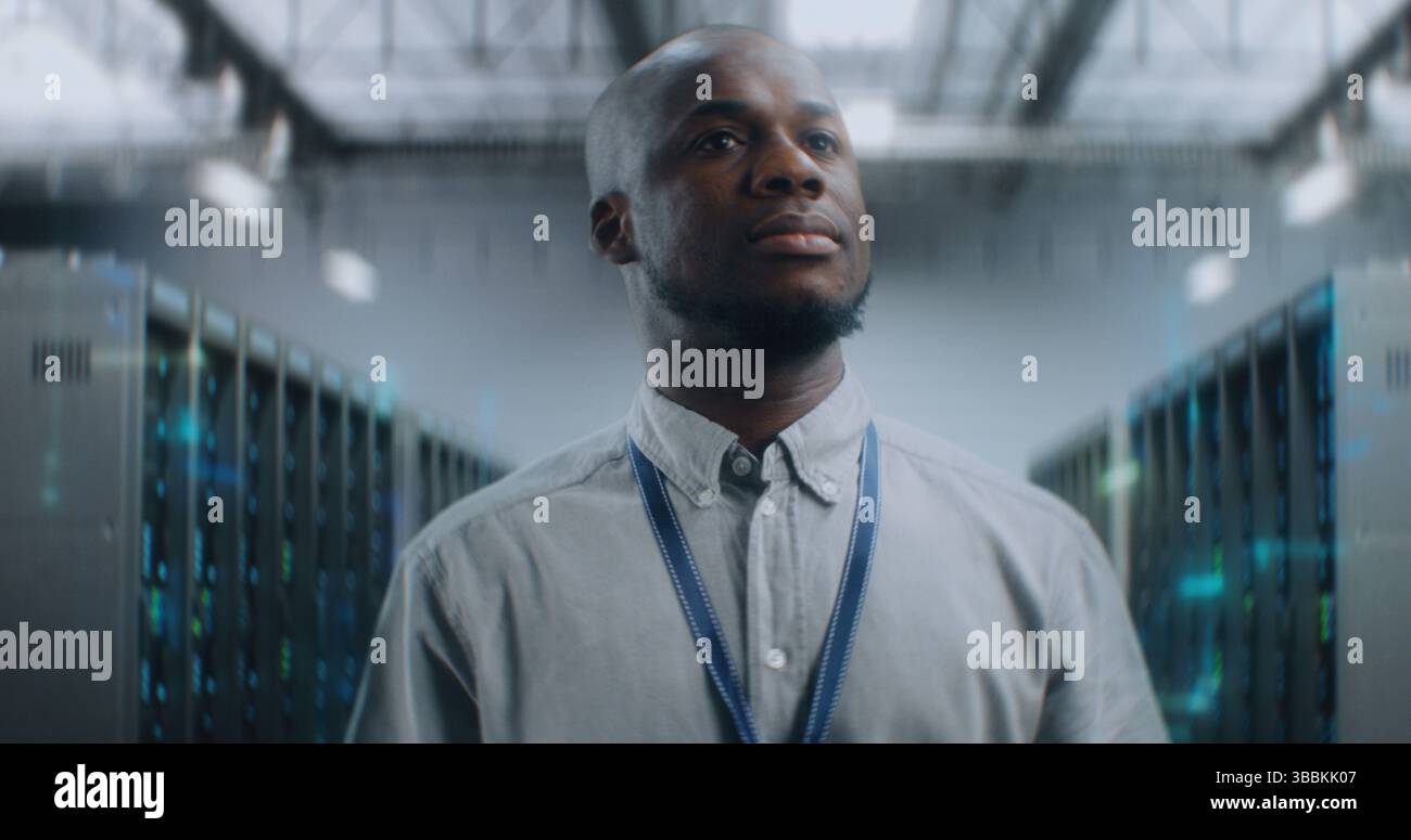 African American Administrator Walking in Futuristic Big Data Center ...