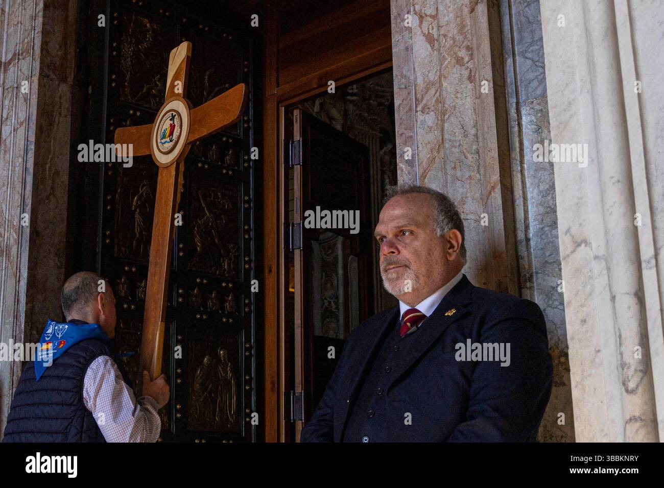 Jubilee Saint Peters Basilica - Holy door A pilgrim crosses the Holy ...
