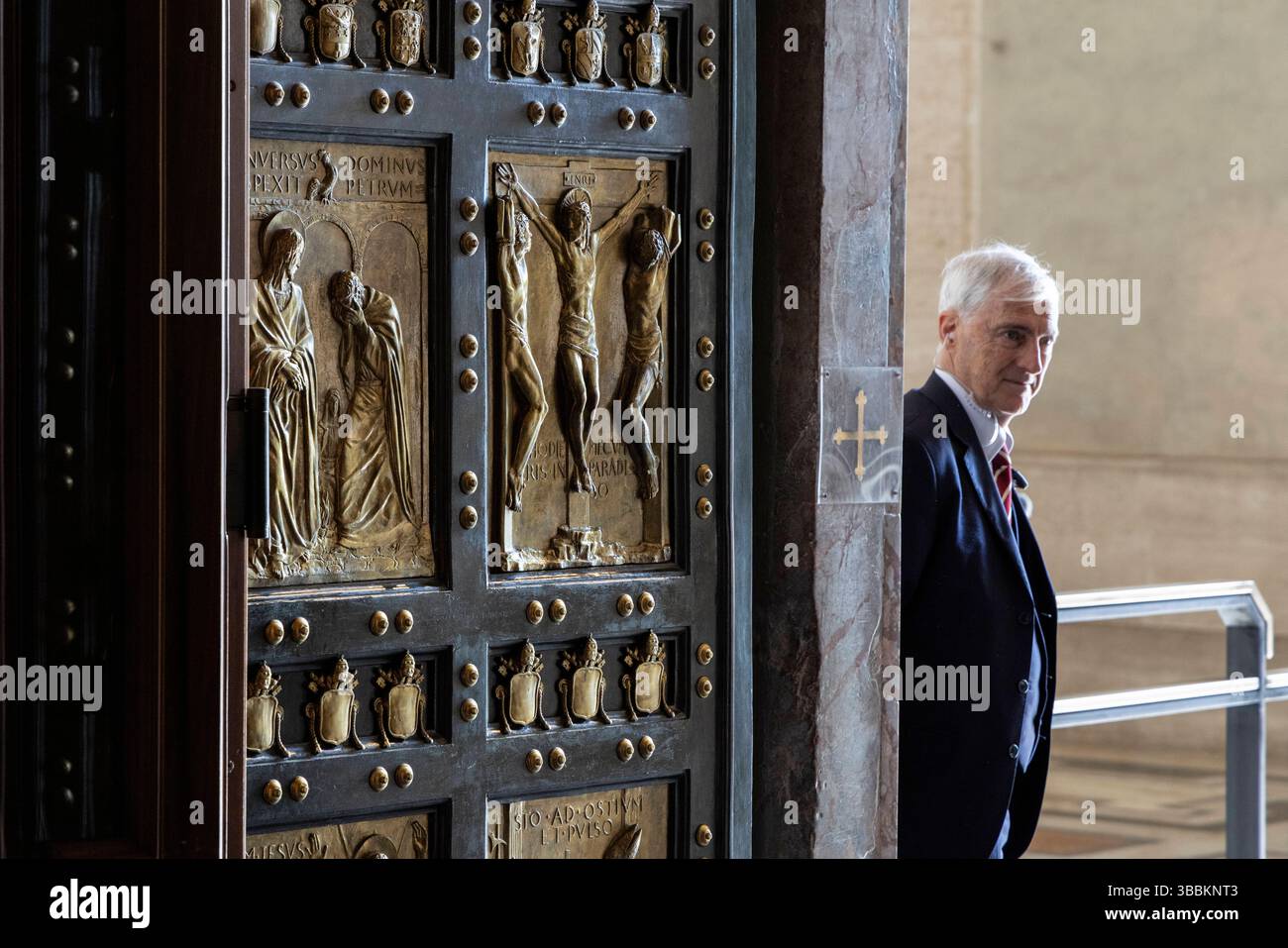 Jubilee Saint Peters Basilica - Holy door A man guard the entrance of ...