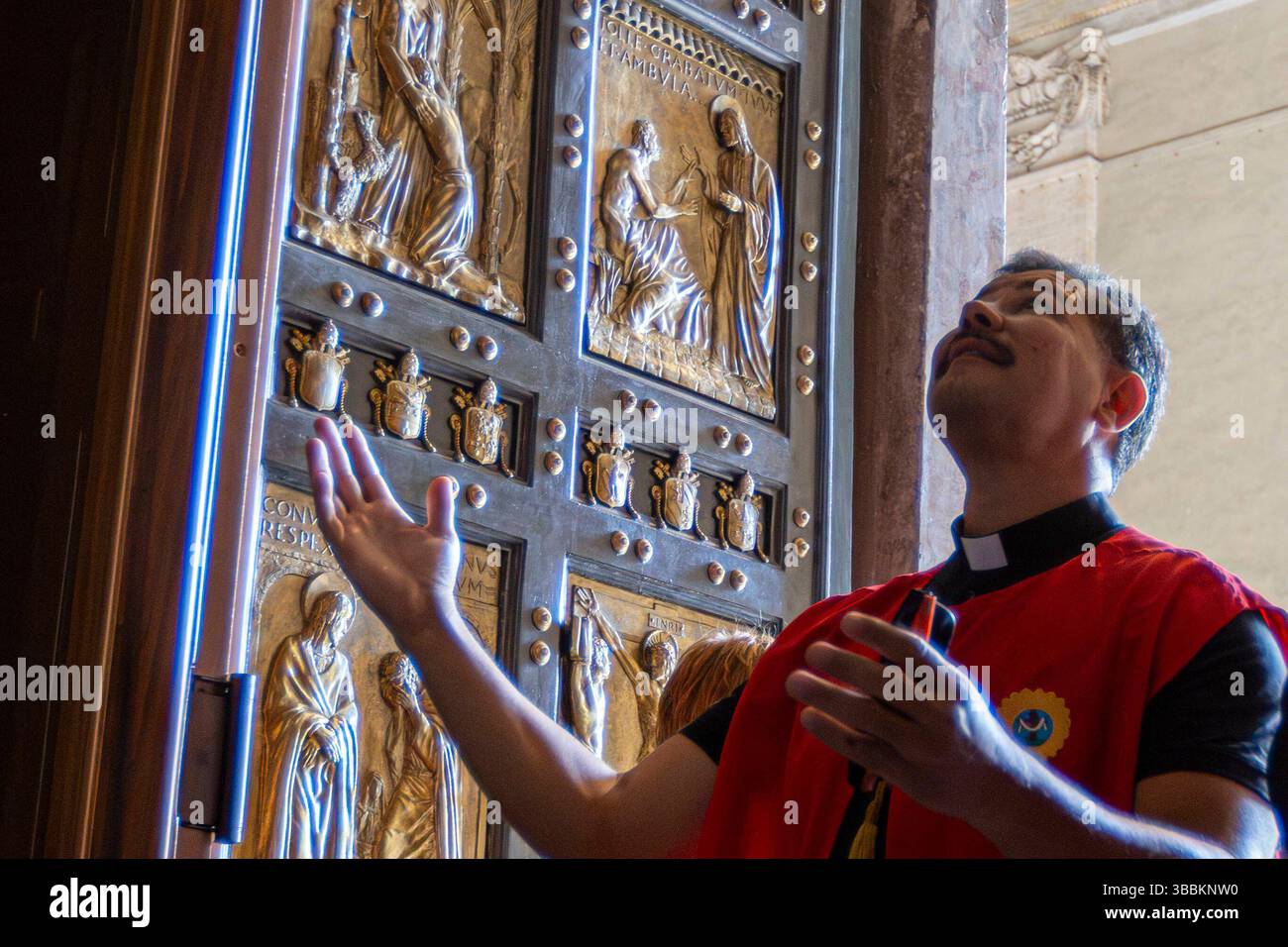 Jubilee Saint Peters Basilica - Holy door A Pilgrim crosses the Holy ...