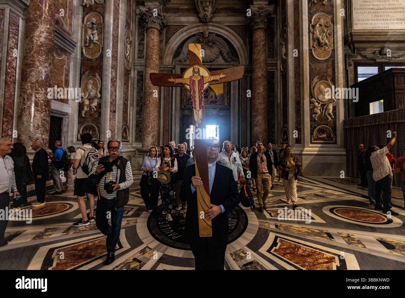 Jubilee Saint Peters Basilica - Holy door Pilgrims hold a cross after ...