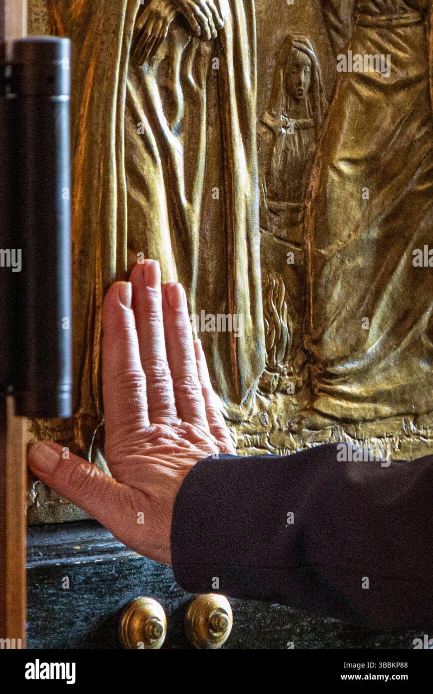Jubilee Saint Peters Basilica - Holy door A Pilgrim put her hand on the ...