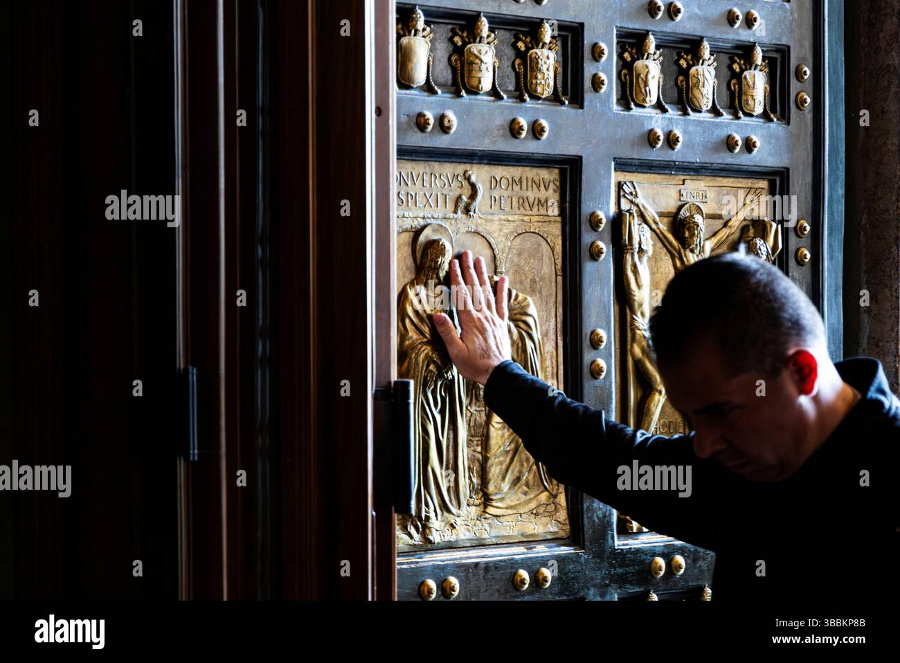 Jubilee Saint Peters Basilica - Holy door A Pilgrim crosses the Holy ...