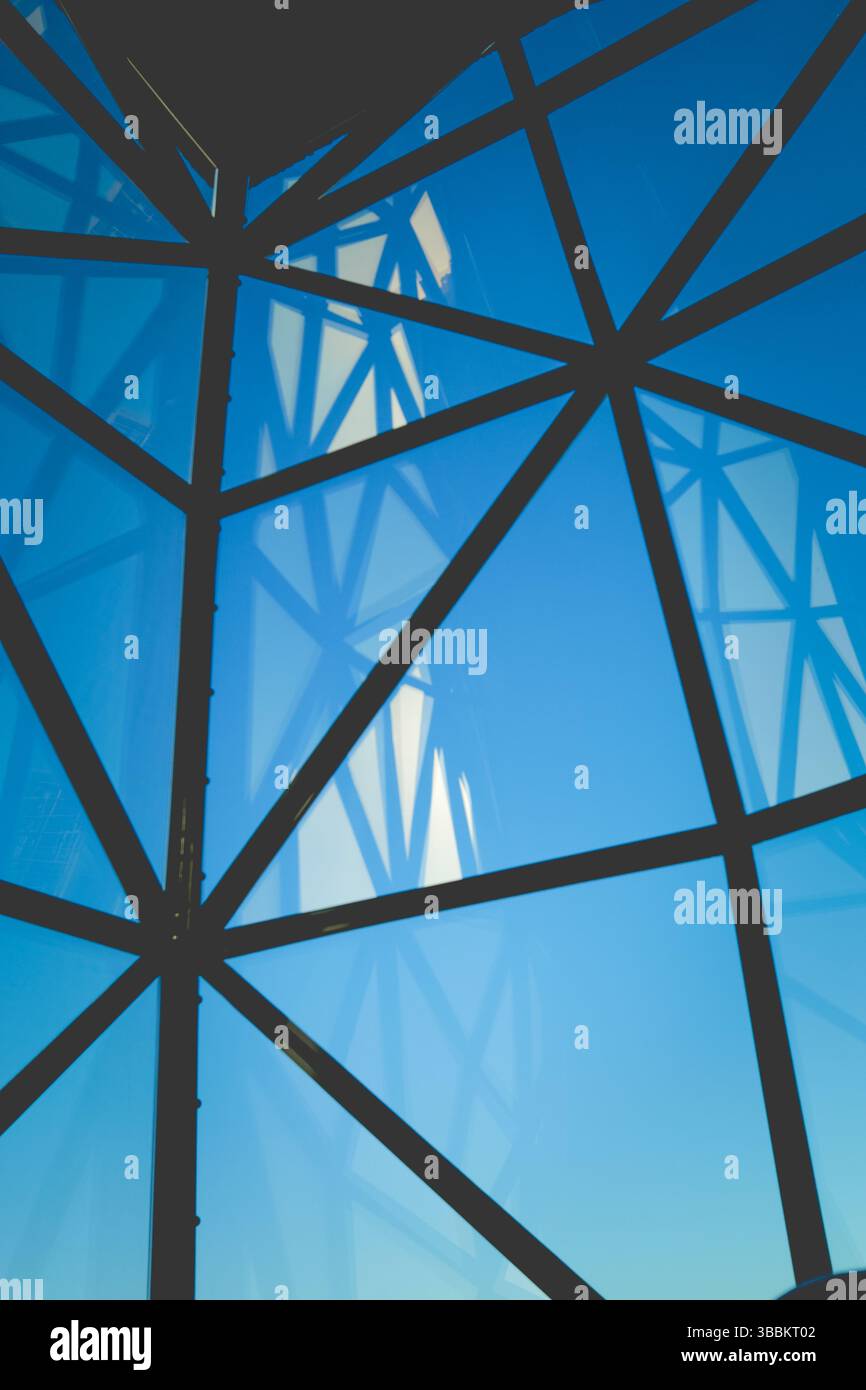 Building with glass geometric shaped windows Stock Photo - Alamy
