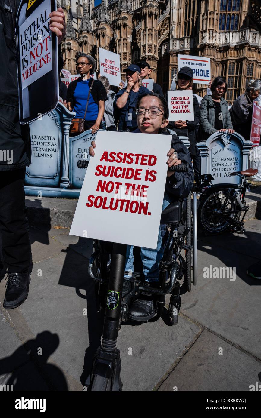 London, UK. 16th May, 2025. A young girl in a wheelchair protests ...