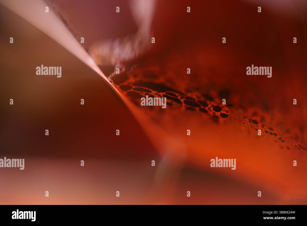 Red fluid reflections on black background, liquid surface abstraction ...