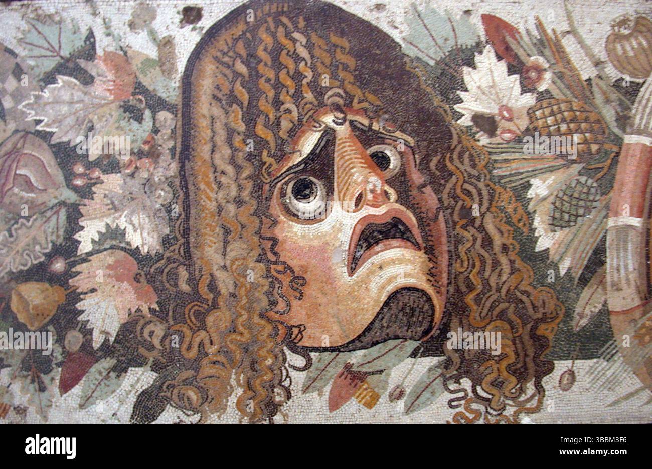 Masks, leaves and fruit, detail from a Roman mosaic - Mosaic depicting ...