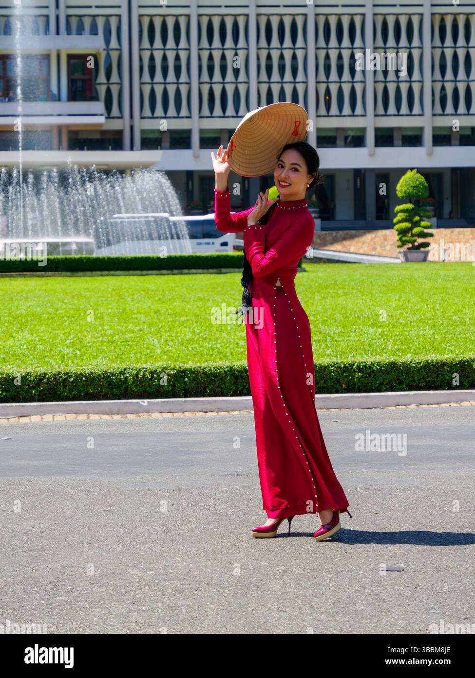 Vietnamese woman poses in traditional style dress, Independence Place ...
