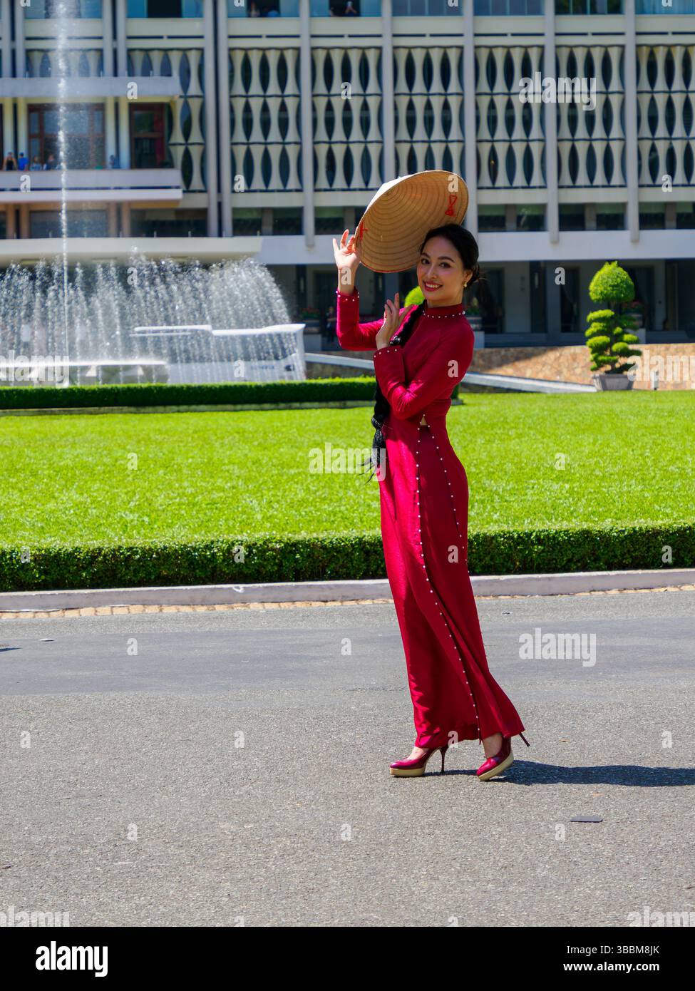 Vietnamese woman poses in traditional style dress, Independence Place ...