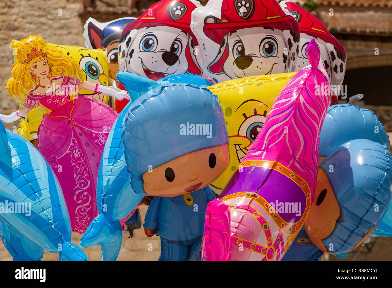 Children's character balloons for sale. A bunch of multicoloured helium ...