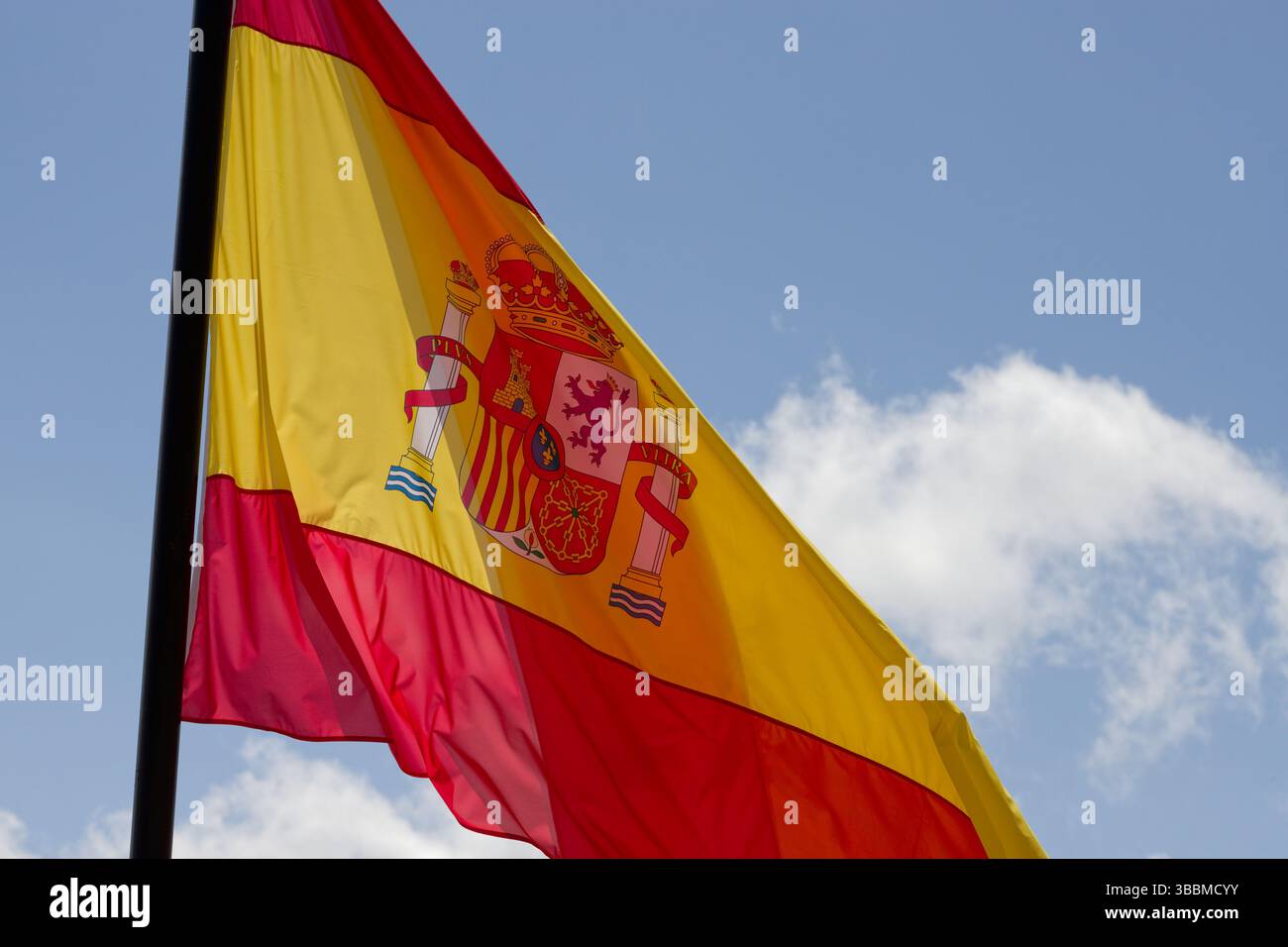 The Spanish national flag flying in a light breeze Stock Photo - Alamy