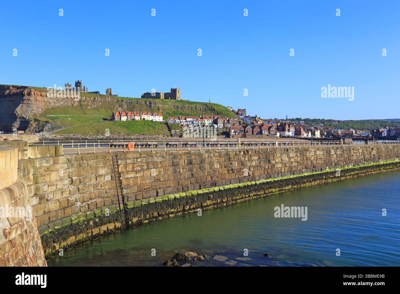 West pier with St Mary's Church and Whitby Abbey on East Cliff, Whitby ...
