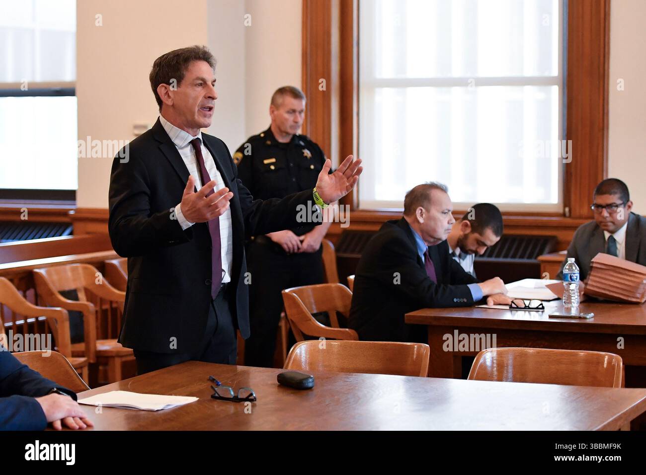Chautauqua County district attorney Jason Schmidt, left, addresses the ...