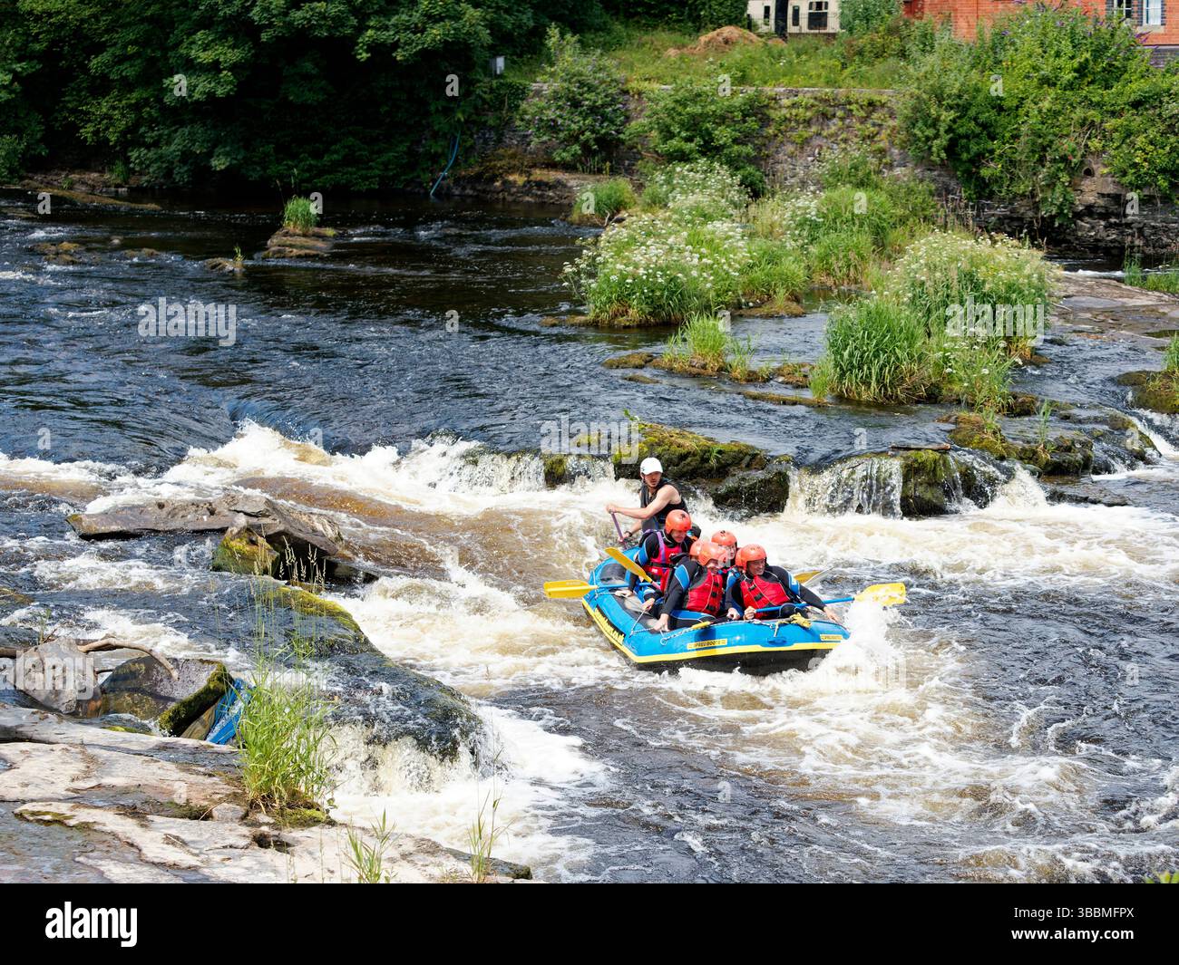 White water rafting on the River Dee at Llangollen with an inflatable ...