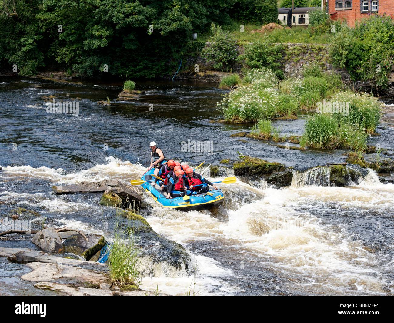 White water rafting on the River Dee at Llangollen with an inflatable ...