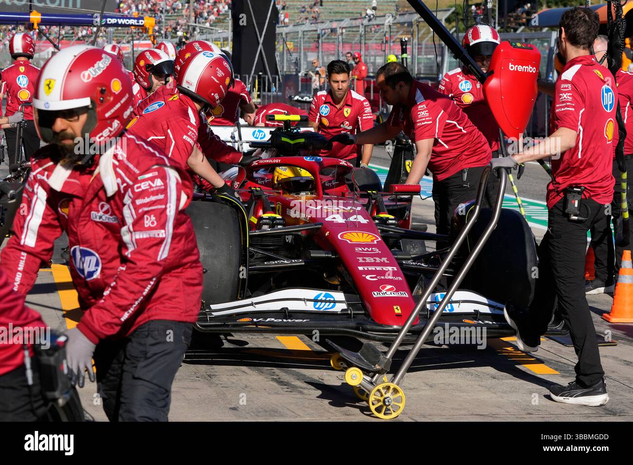 Ferrari driver Lewis Hamilton of Britain gets pushed back into his ...