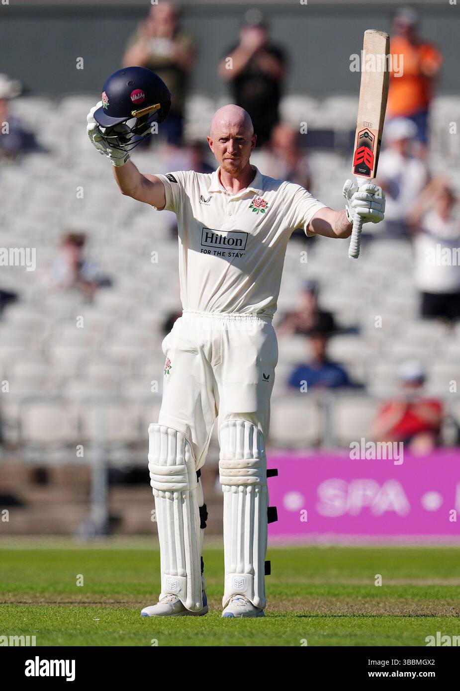 Lancashire's Luke Wells celebrates hitting a century on day one of the ...