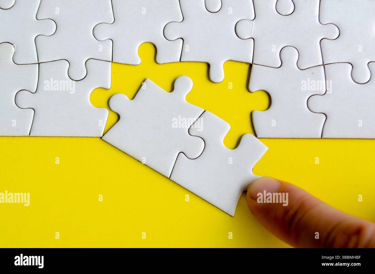 Hand placing missing jigsaw puzzles. A simple yet powerful concept of ...