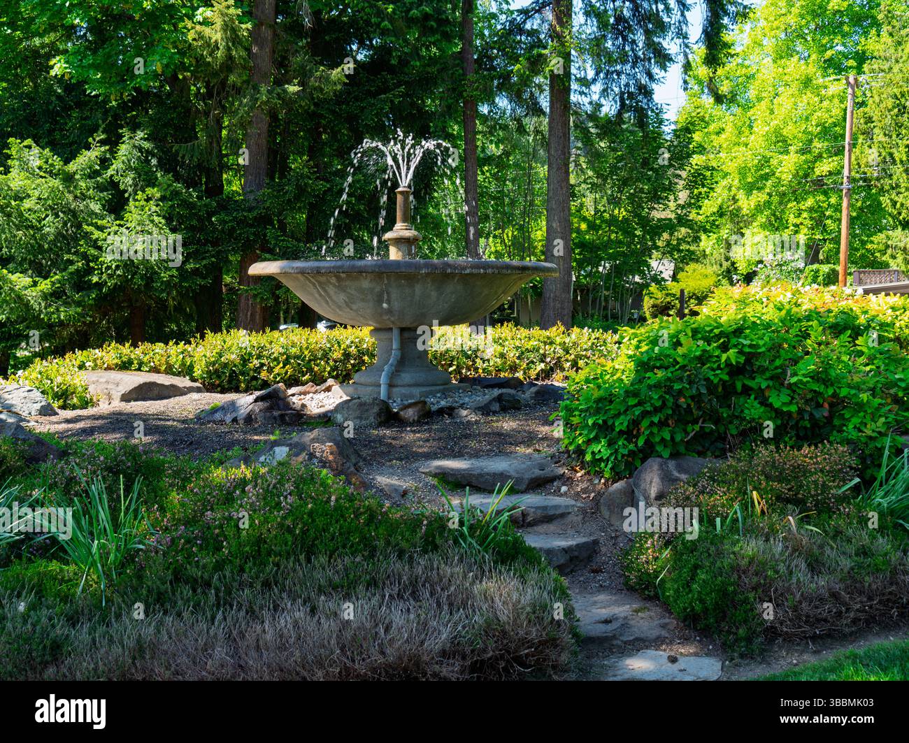 A fountain and stone steps in the residential neighborhood of Normandy ...