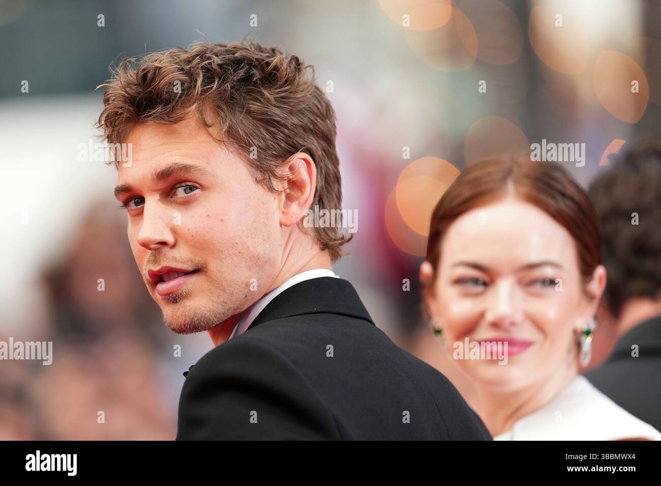 Austin Butler, left, and Emma Stone pose for photographers upon arrival ...
