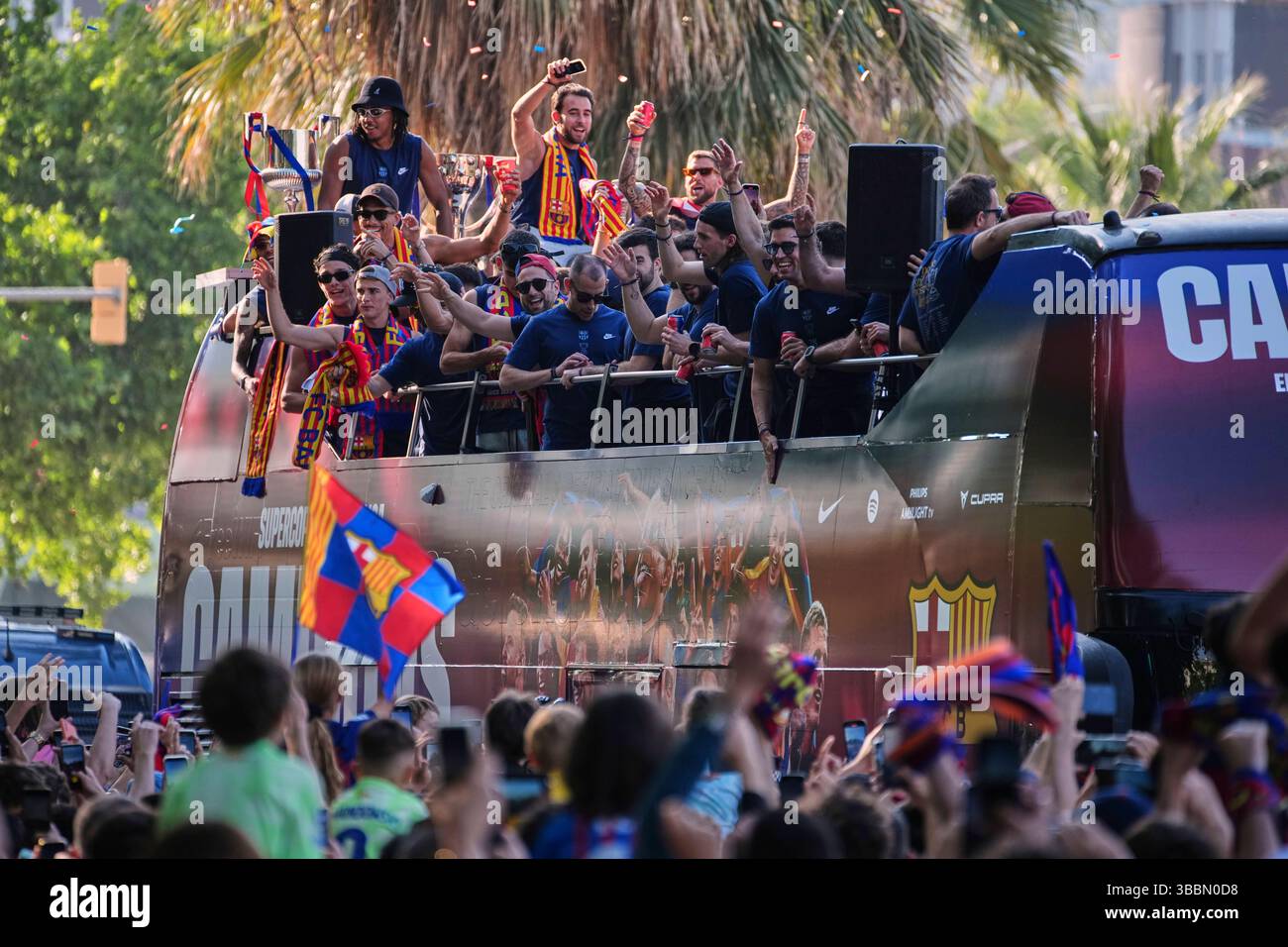 FC Barcelona players celebrate on the top of a bus their victory in the ...