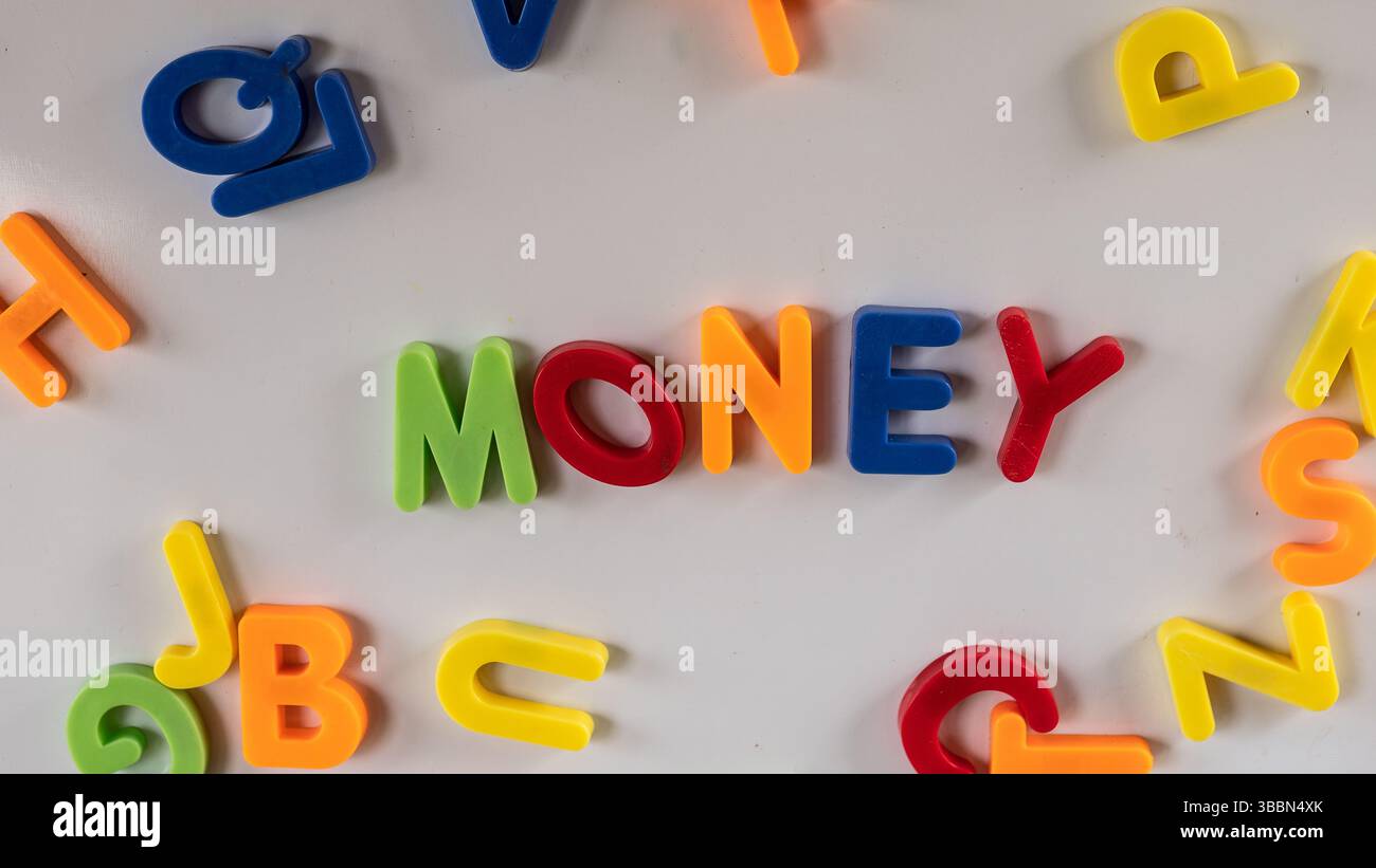 Colorful Magnetic Letters money on a Wooden Frame Whiteboard in ...