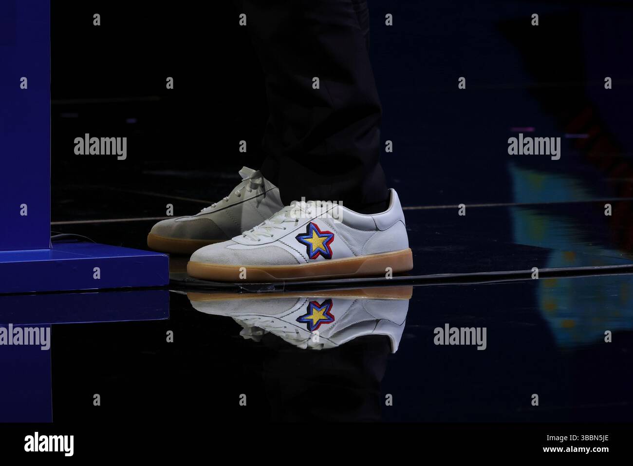 The shoes of Albanian Prime Minister Edi Rama are reflected on the ...