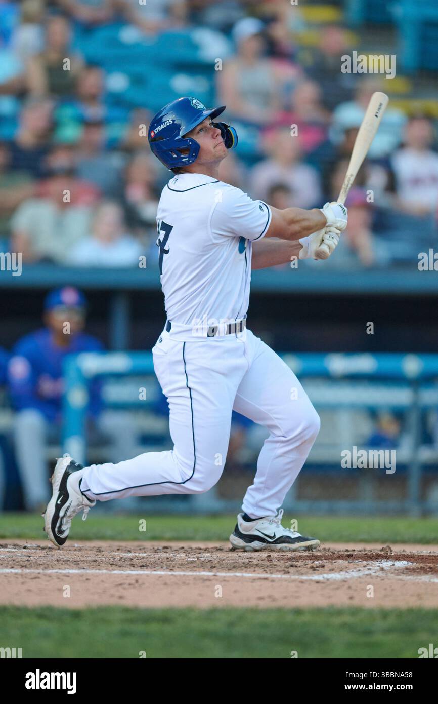 Asheville Tourists Trevor Austin (17) swatches the flight of the ball ...