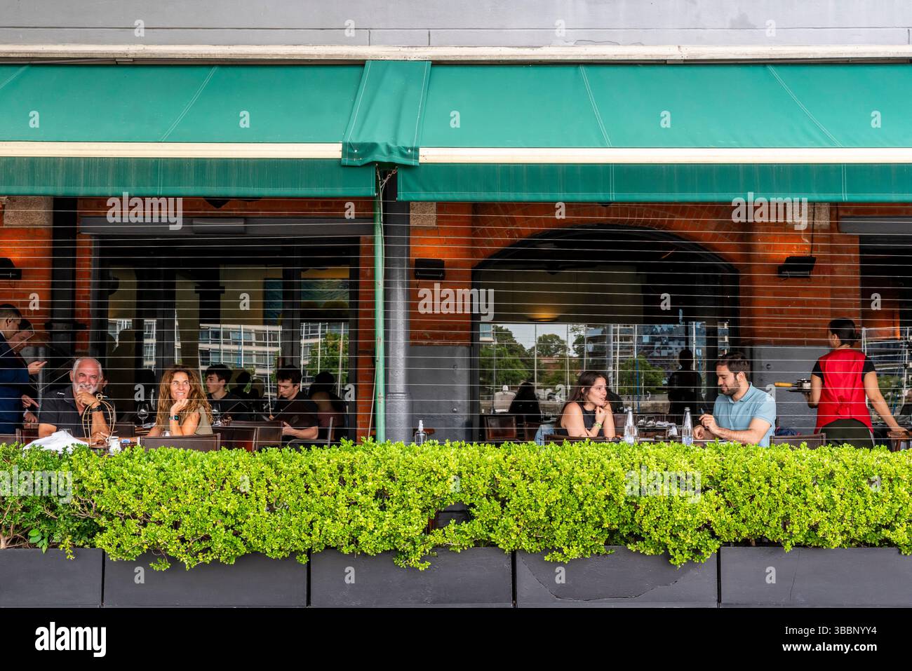 Argentine People Eating Lunch At A Waterfront Restaurant In The Puerto ...