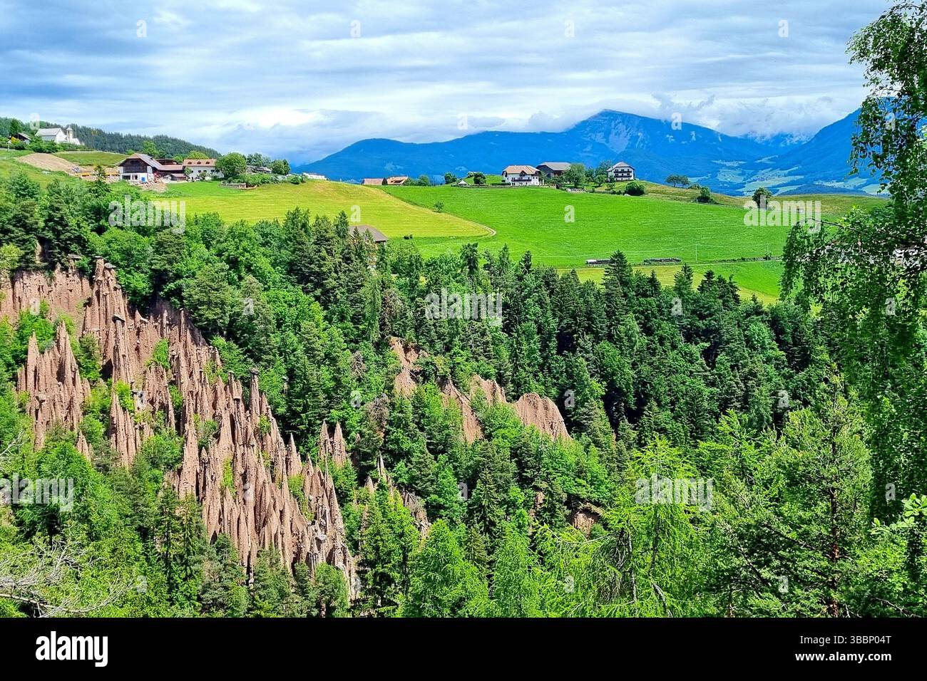 Tyrolean pastoral landscape with famous Renon Earth Pyramids, northern ...