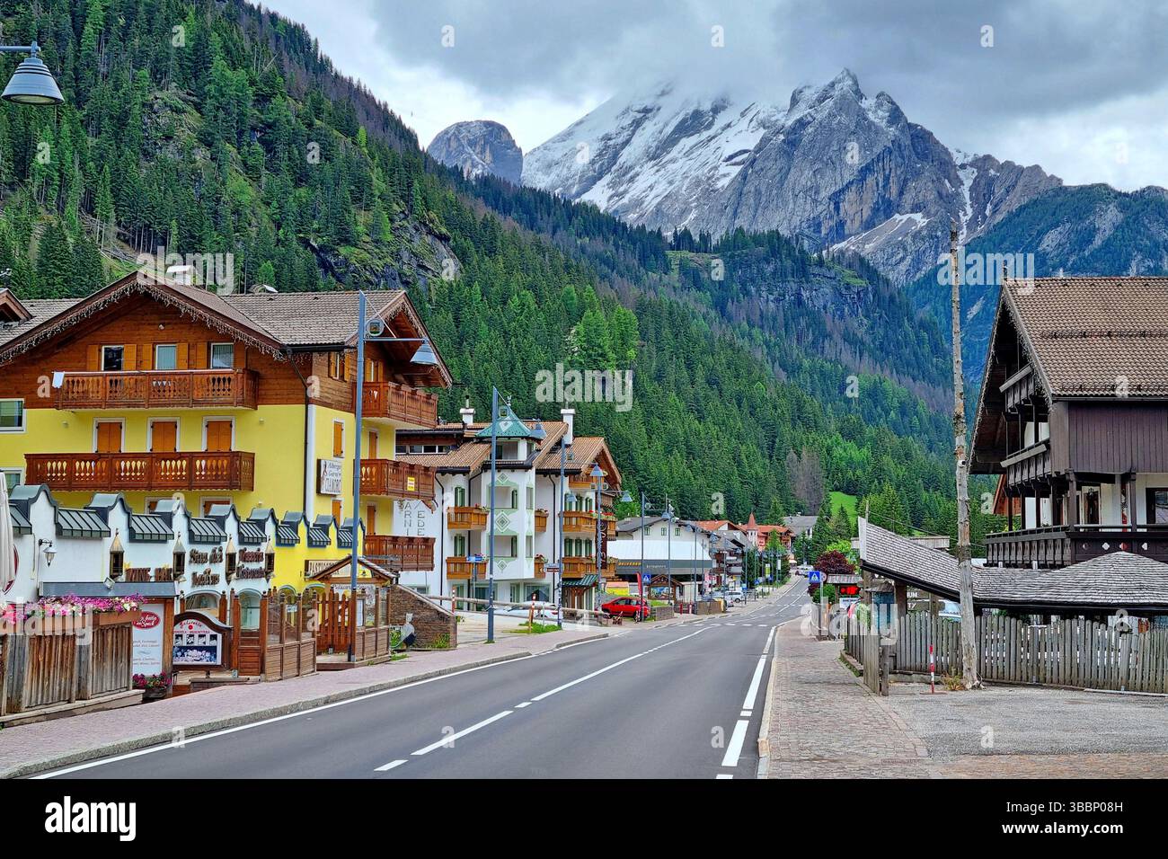 Canazei, Italy - June 13, 2024: View of colorful houses on the main ...
