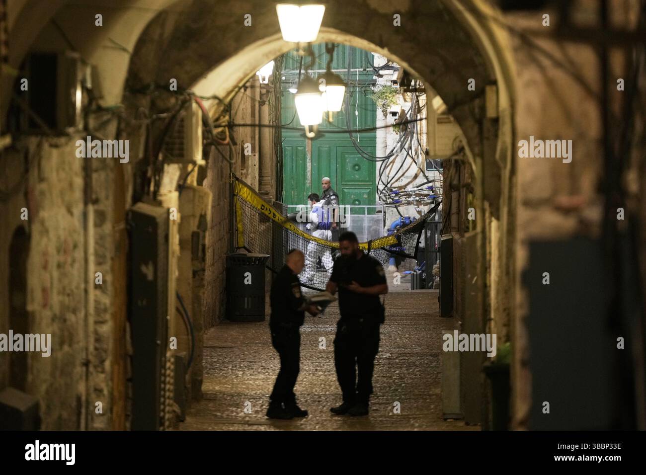 Israeli security forces stand guard near the scene of a stabbing attack ...