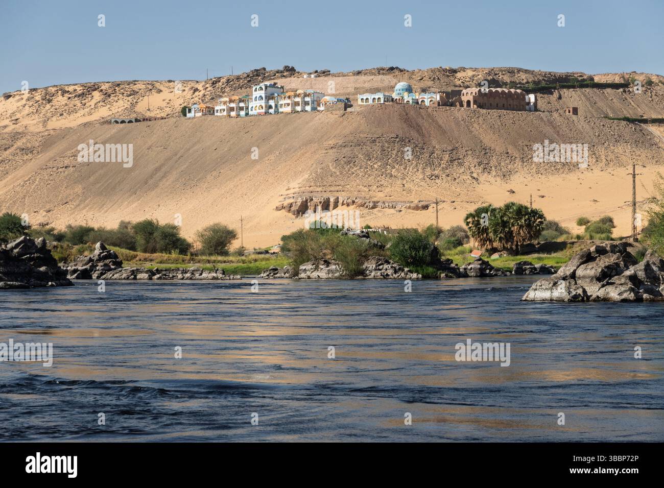 Granite rocks in the fast flowing water of the River Nile near Aswan ...