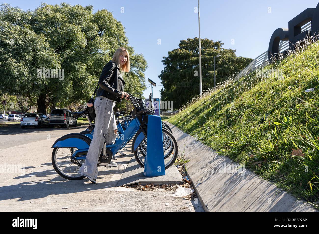 Woman picking up bicycle hi-res stock photography and images - Alamy