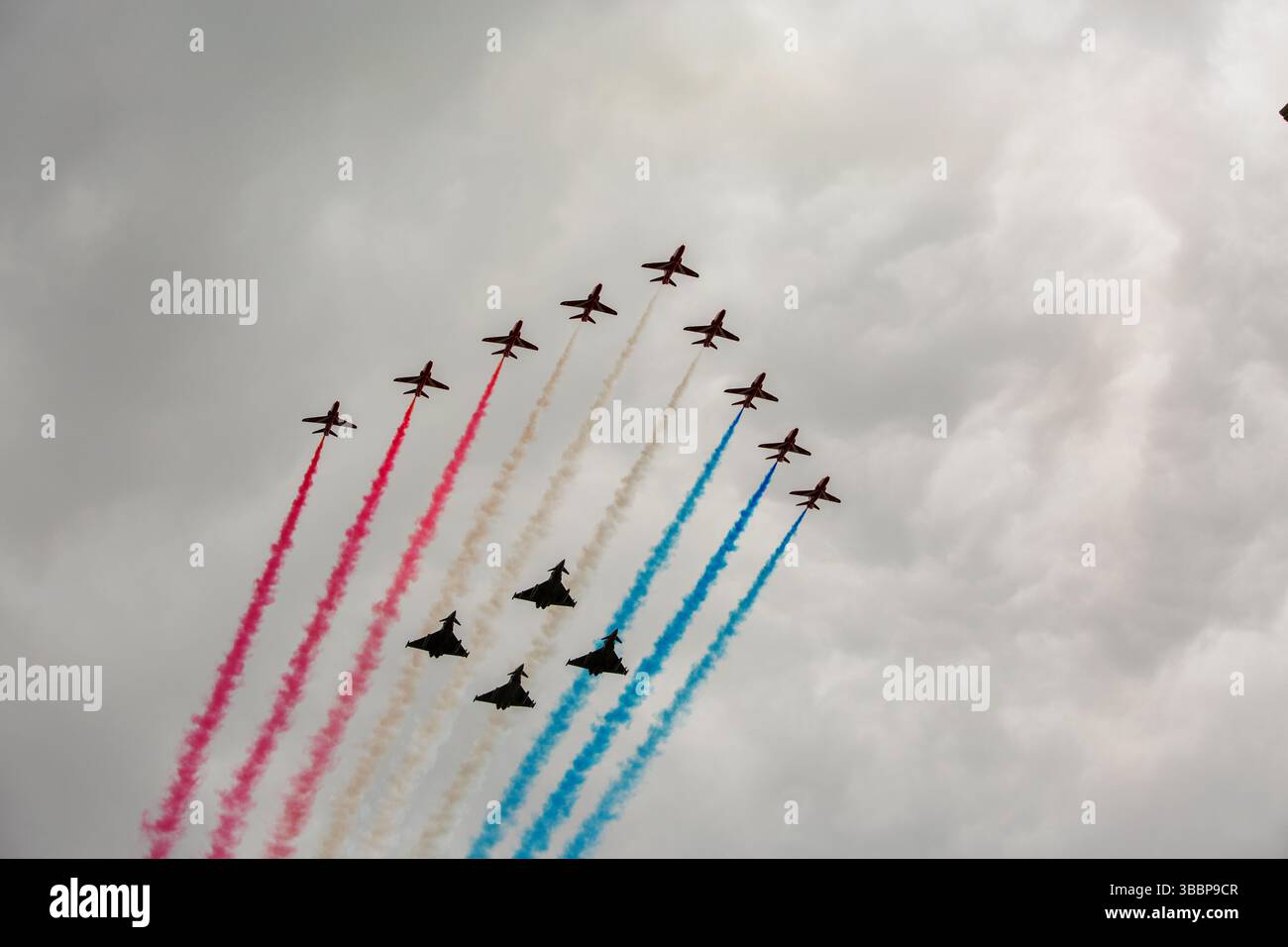 Red Arrows and Fighter Jets in flight, with red, white & blue trails to ...