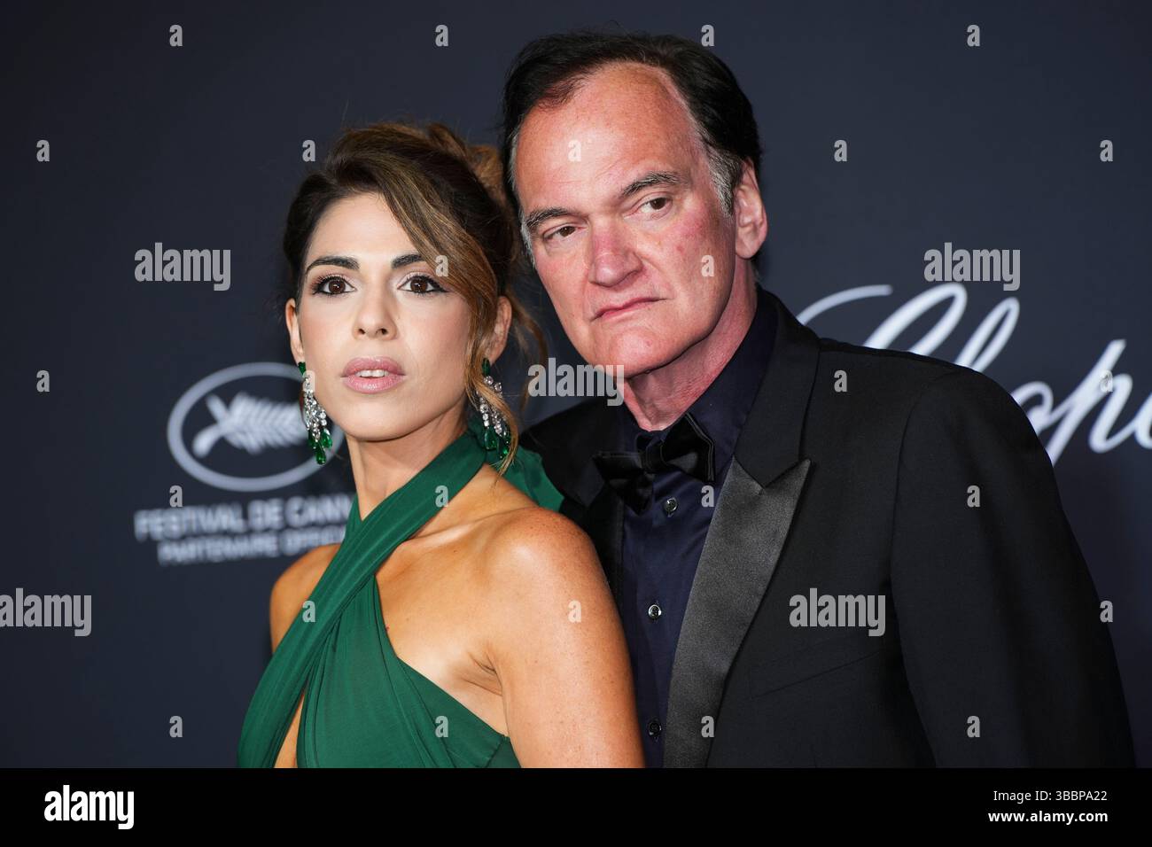 Daniella Pick, left, and Quentin Tarantino pose for photographers upon ...