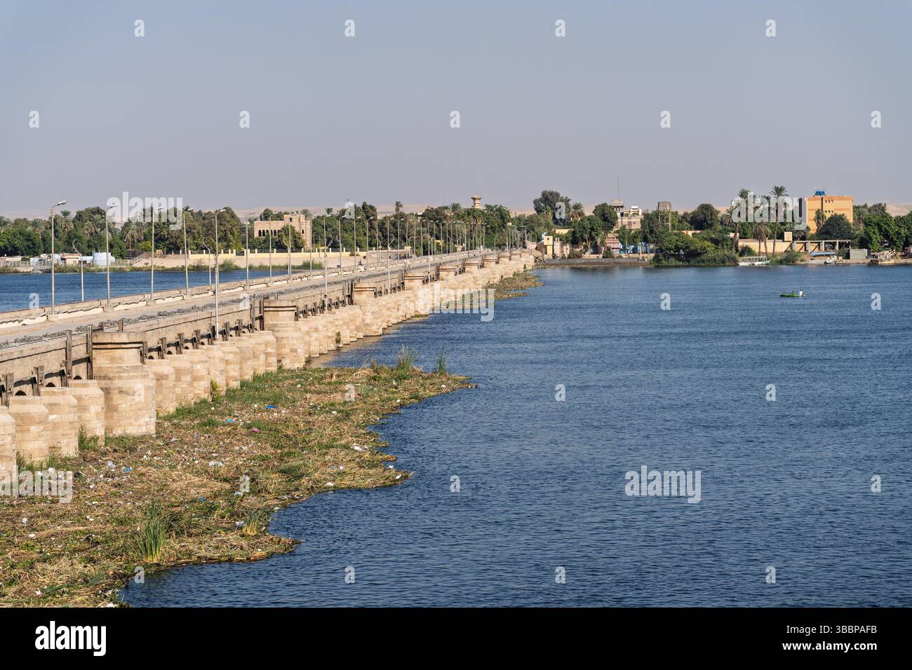Old Esna dam and lock across the Nile River with sandy hills of Sahara ...