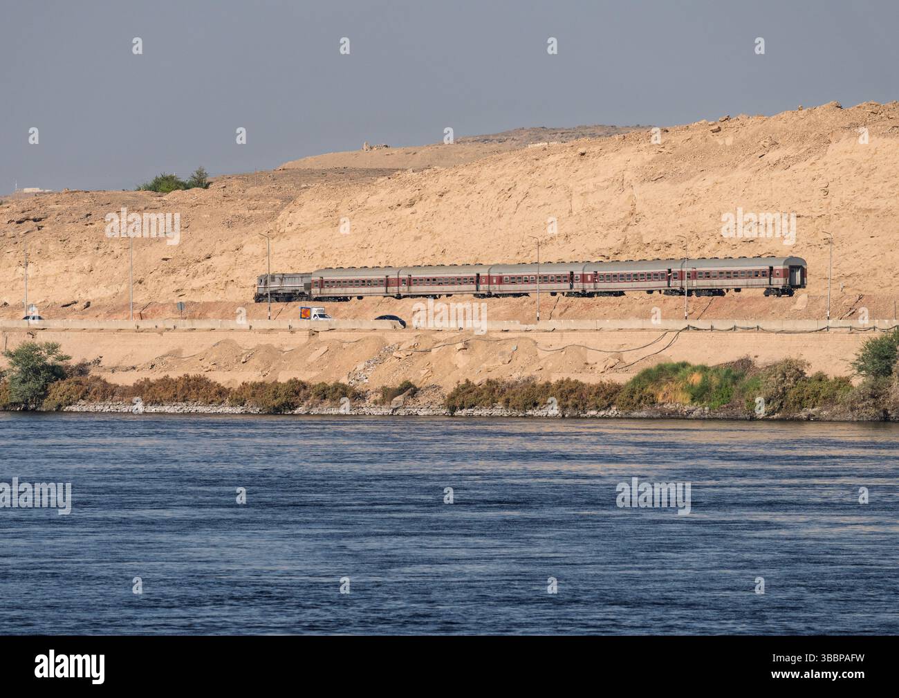 Egyptian passenger train alongside the River Nile near Aswan and ...