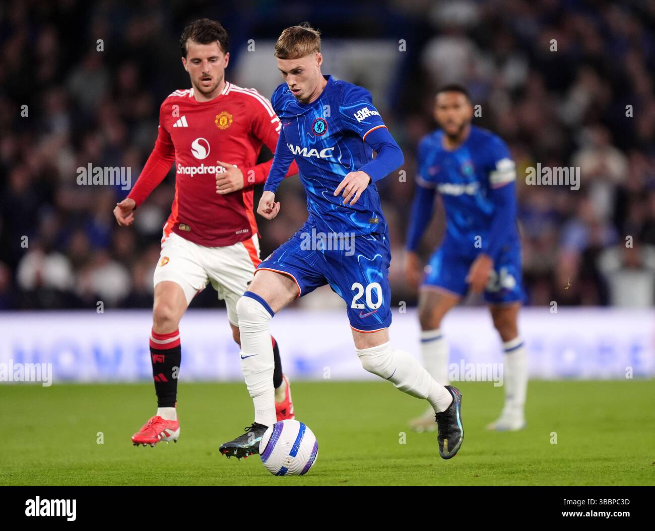 Manchester United's Mason Mount and Chelsea's Cole Palmer battle for ...